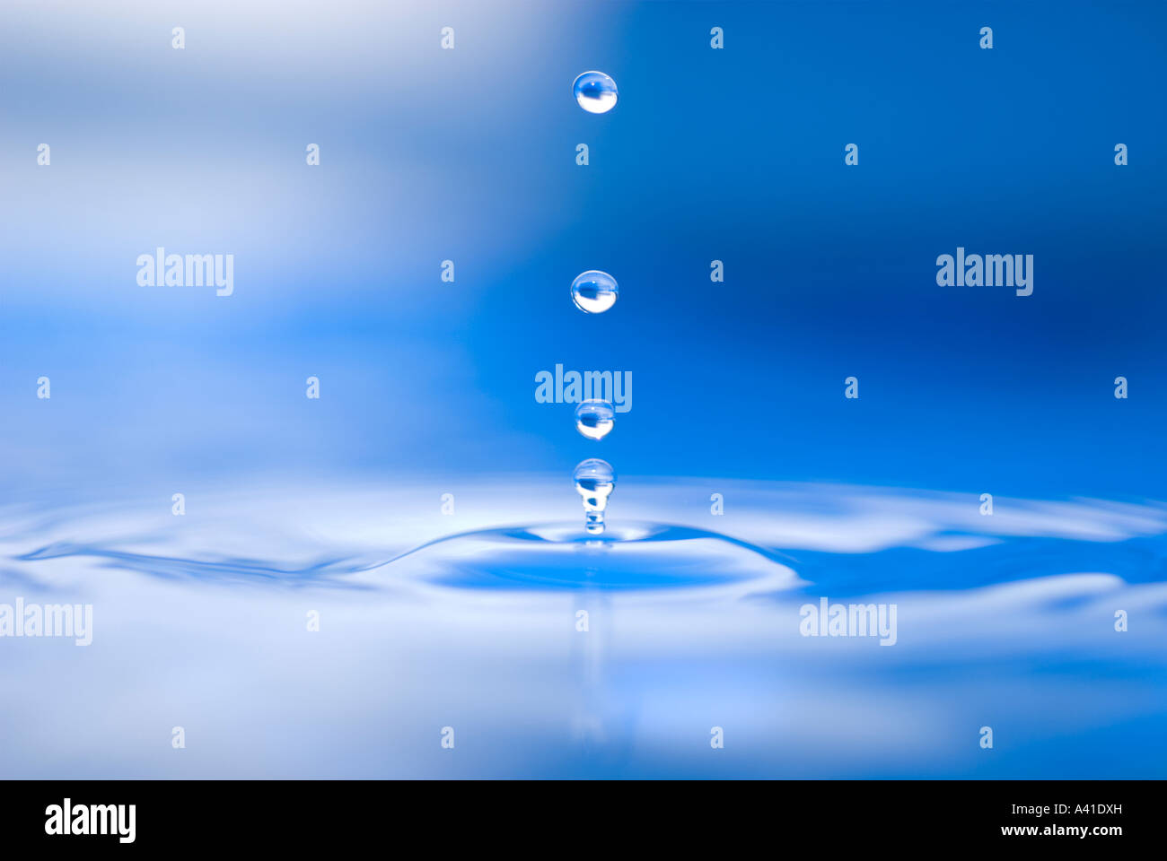 blue water and four falling waterdrops Stock Photo - Alamy