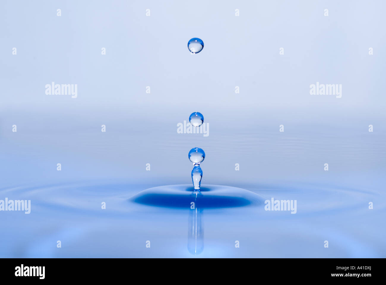 blue water and falling waterdrops Stock Photo - Alamy