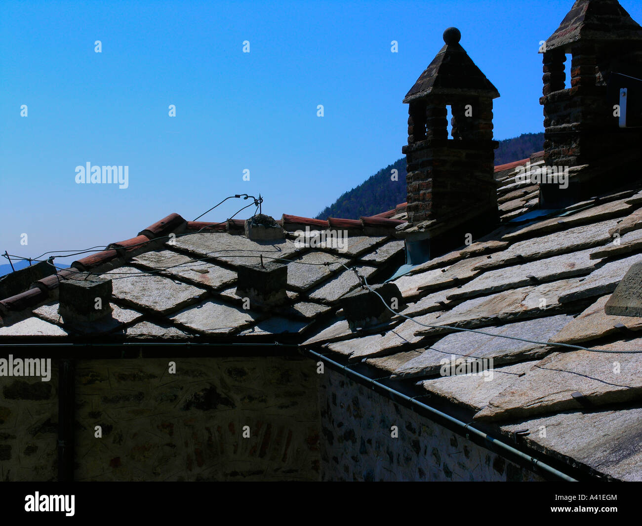 Typical Alpine roof made of heavy stone plates Stock Photo - Alamy