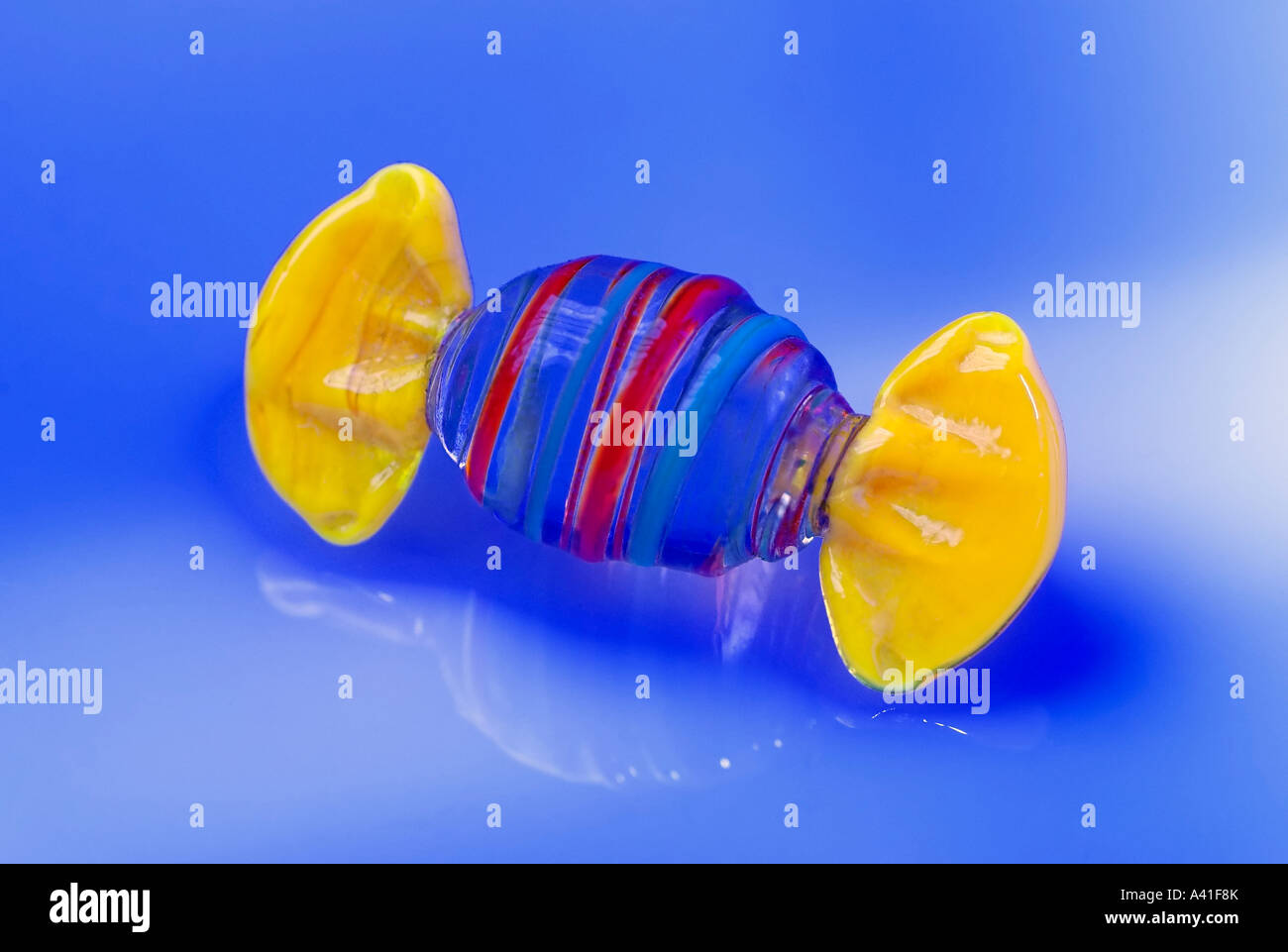 Piece of candy in wrapper Stock Photo - Alamy