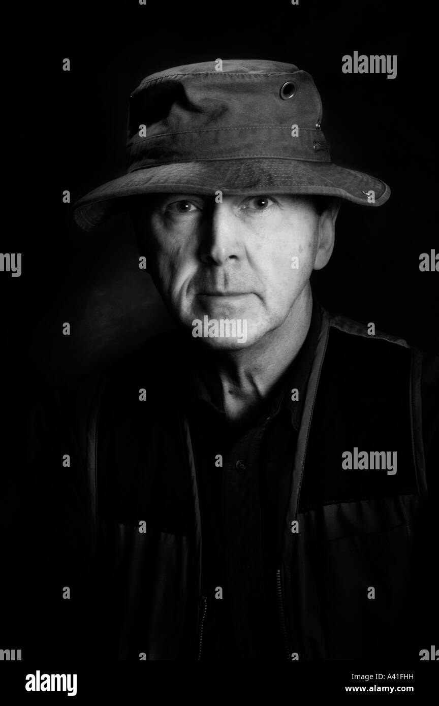 Portrait of a man in an olive green boonie hat. Black and White version ...