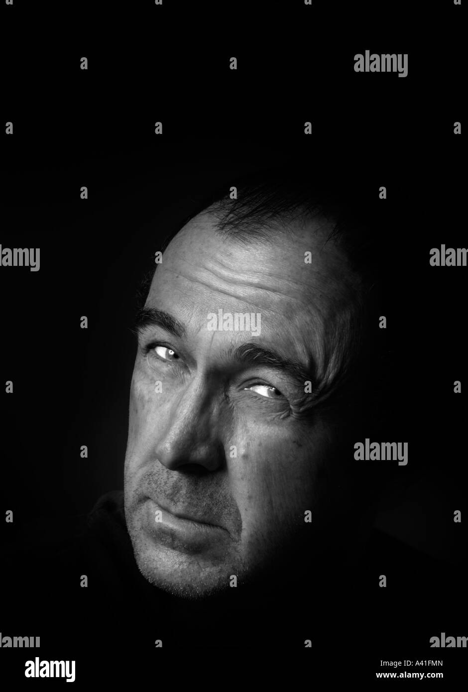 Grizzled old man appears to be watching with intensity Stock Photo - Alamy