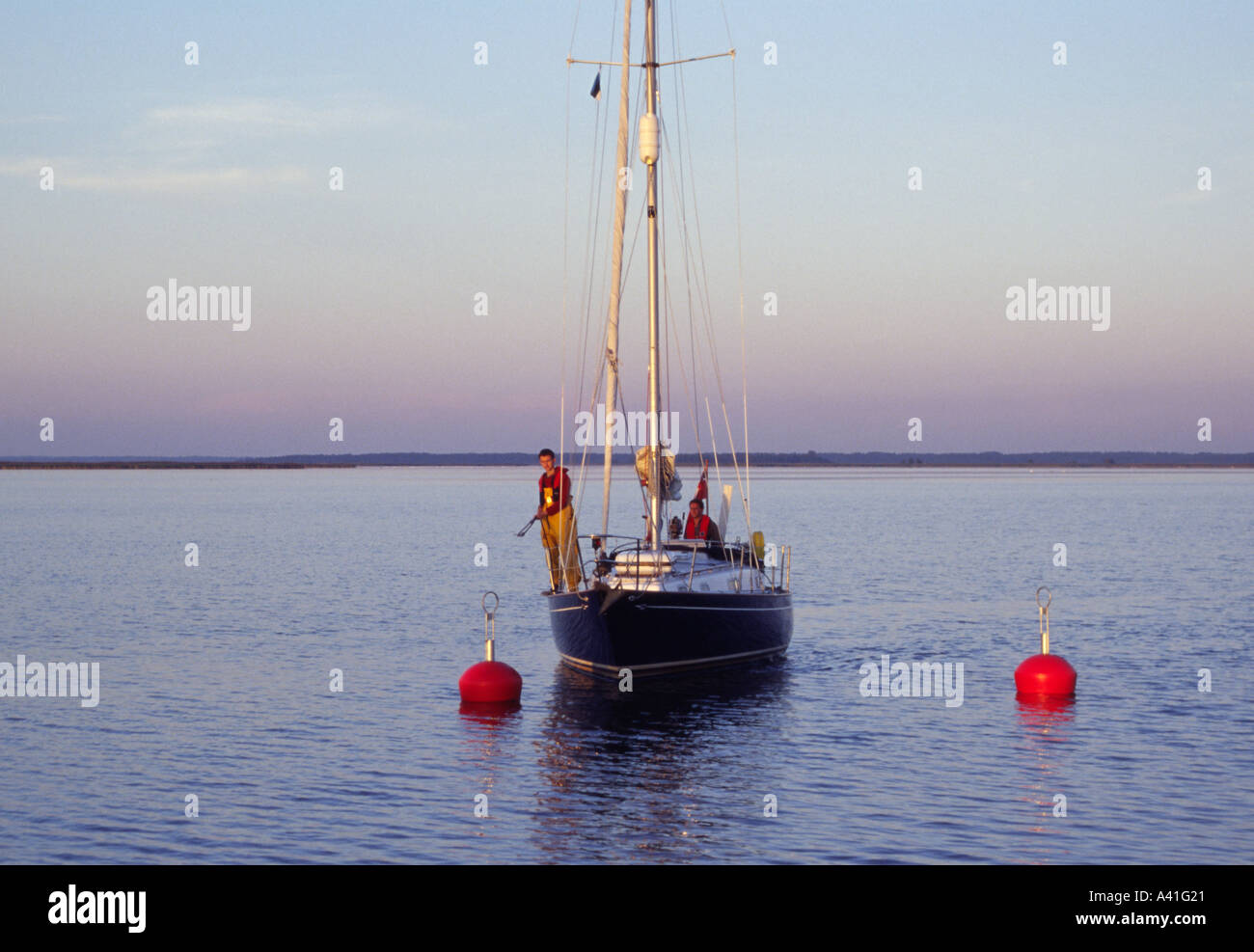 Picking up a mooring buoy mooring in the Baltic style Stock Photo - Alamy