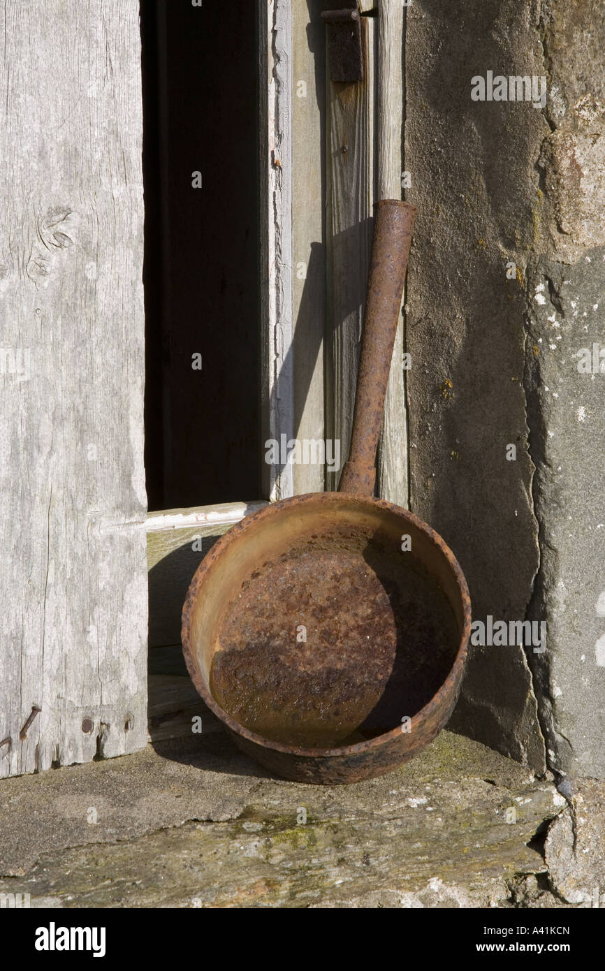 Rusty Kitchen utensils on outside window ledge of abandoned scottish ...