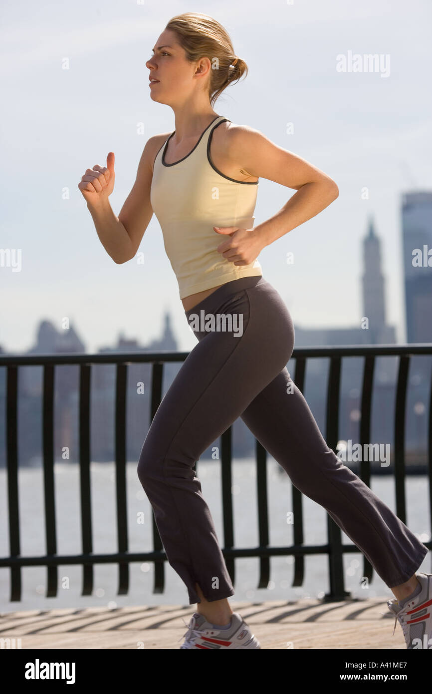 Woman jogging outdoors Stock Photo - Alamy