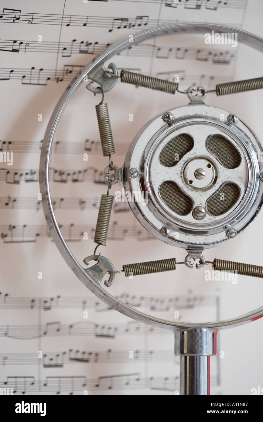 Still life of microphone and sheet music Stock Photo - Alamy