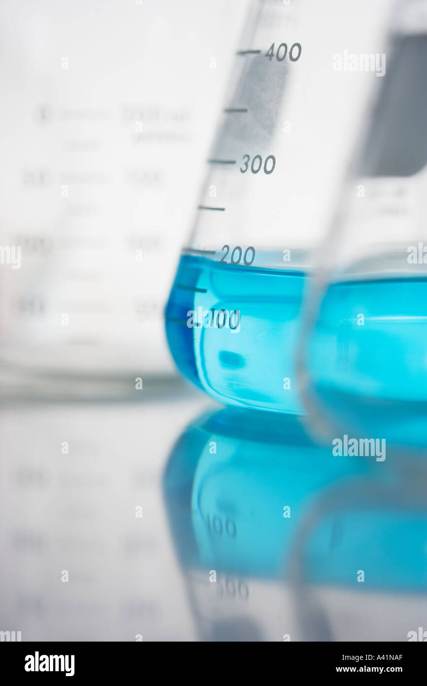Chemicals in beakers Stock Photo - Alamy