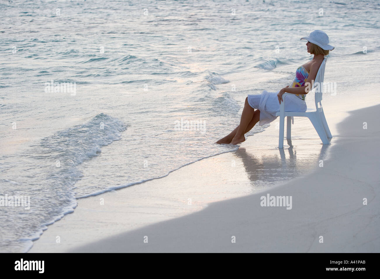 Woman lounging beach hi-res stock photography and images - Alamy