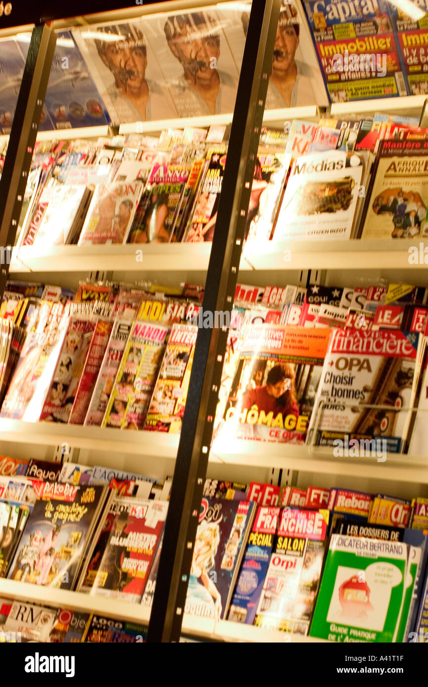 rank and pile of magazine and books in french library Stock Photo - Alamy