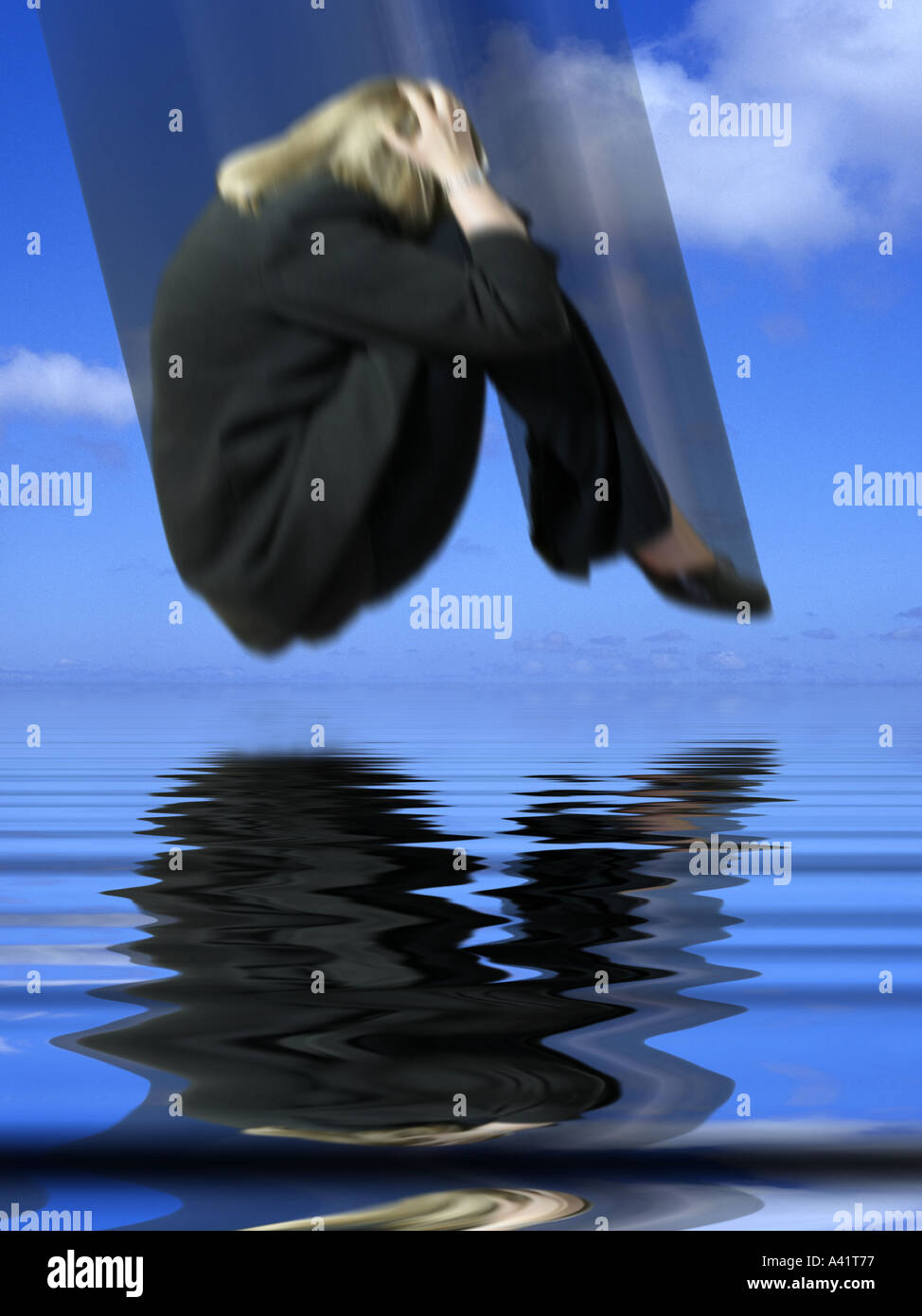 Woman falls quickly through the sky and into some deep water Stock ...