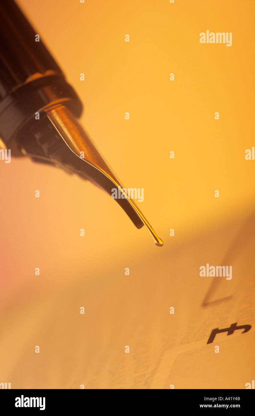 Signing a cheque Stock Photo - Alamy