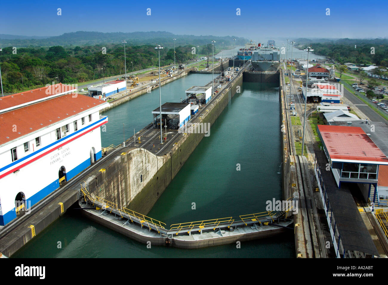 The Panama Canal lock system with lock gates closed and ship entering a ...