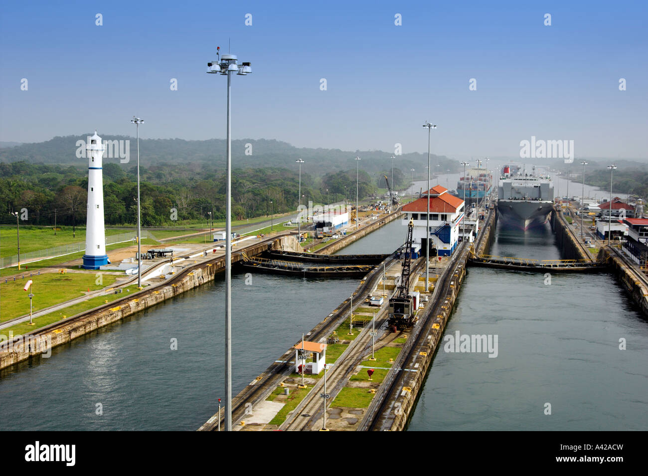 The Panama Canal lock system with ships entering a lower lock Panama ...