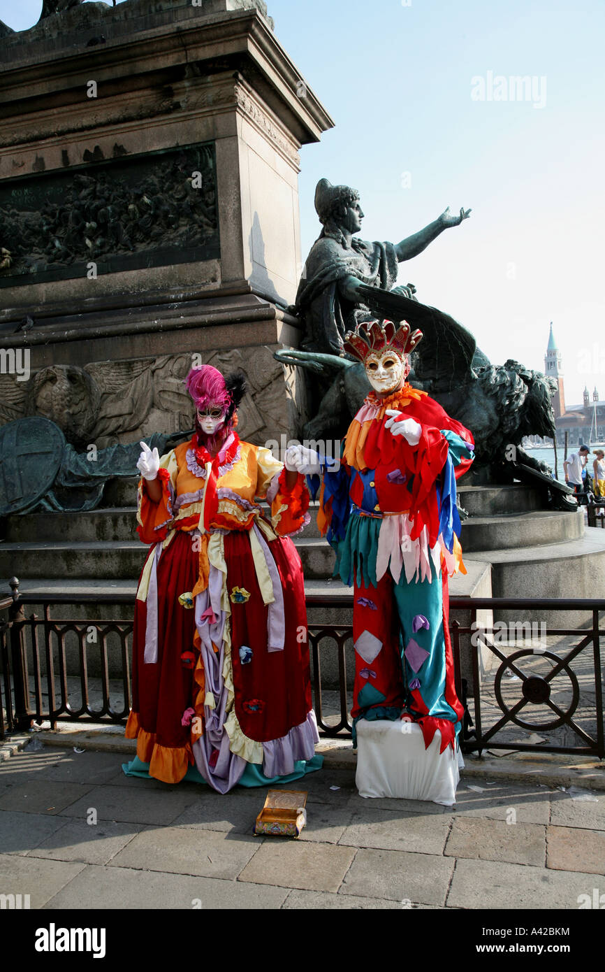 Two Venetian models posing for photographers in Italy; Venice are ...