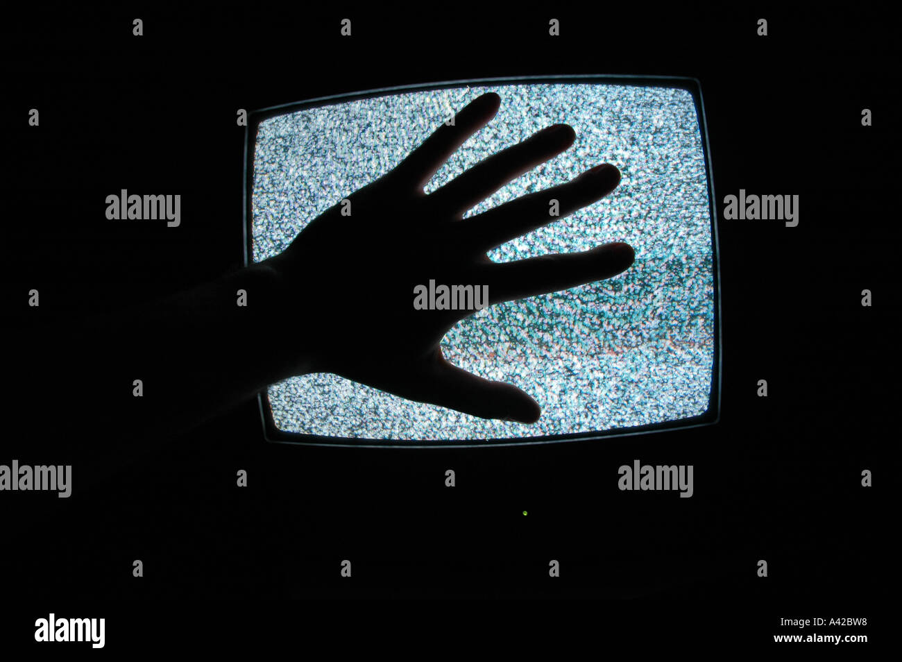 Hand on a television Stock Photo - Alamy