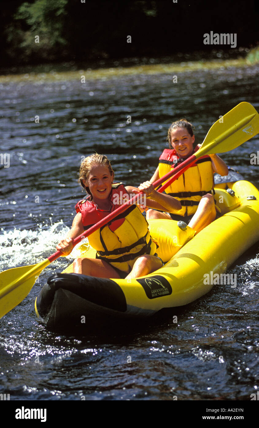 two girls kayaking on the river Kennebec Maine USA after taking a ...