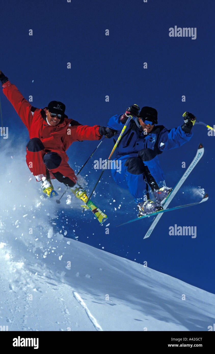 Generic shot of two expert skiers skiing at high speed near the ski ...