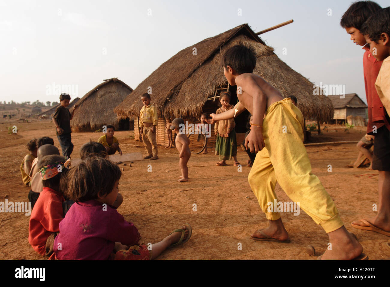 Young members of the Phnong tribe play a traditional game, in the ...