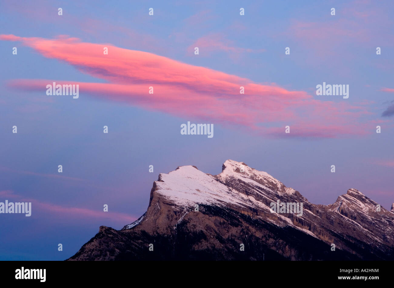 Sunset light on clouds over Mt. Rundle, Banff National Park, Alberta ...