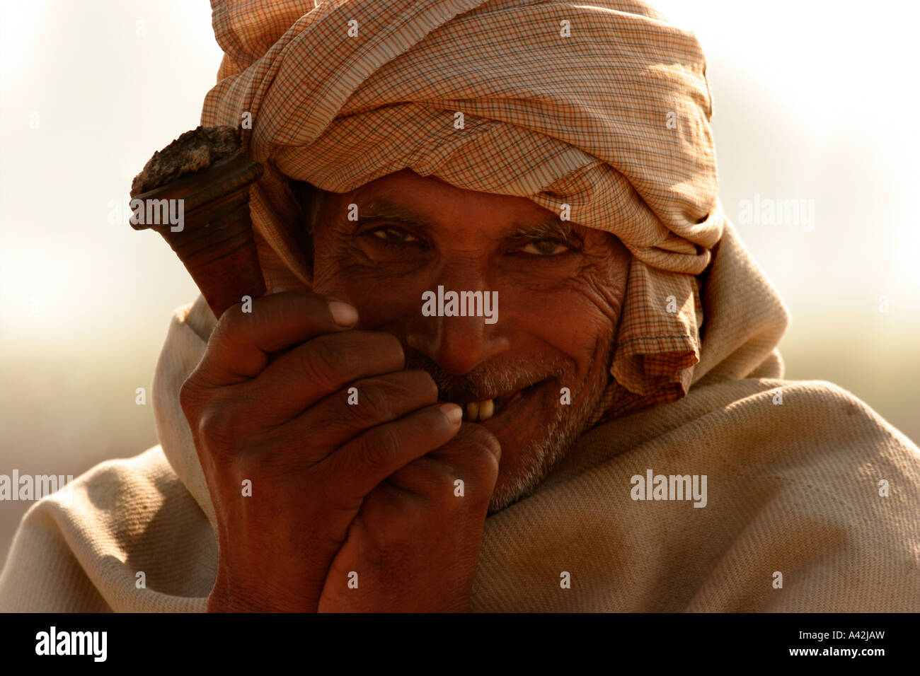Old man smoking clay pipe hi-res stock photography and images - Alamy
