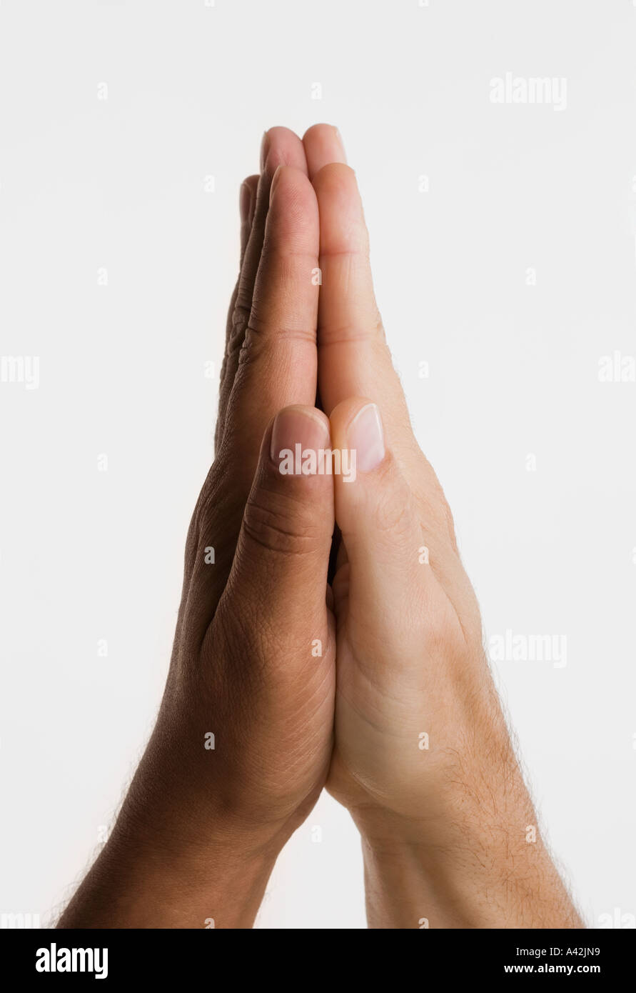 Two praying people hi-res stock photography and images - Alamy