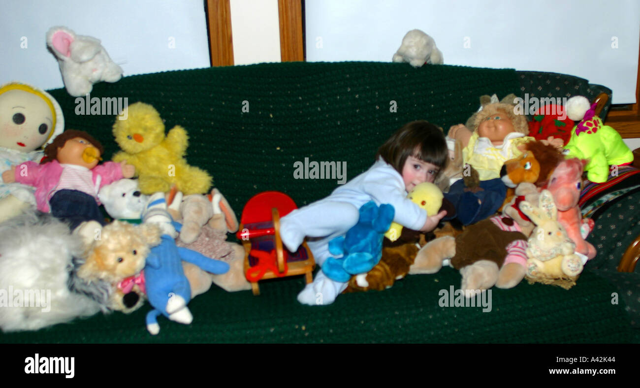 Little girl with her stuffed friends Stock Photo - Alamy