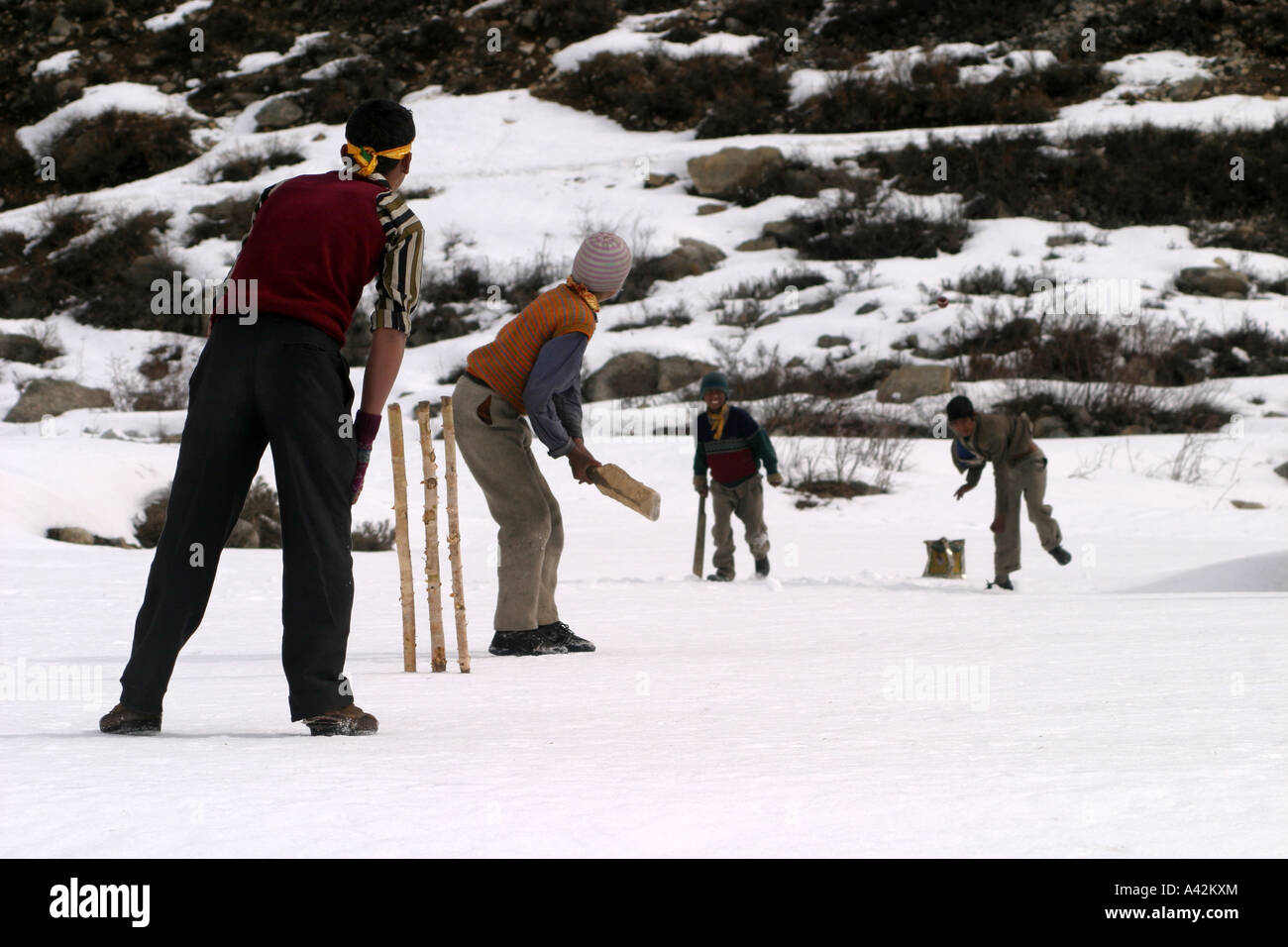Kids play cricket on the frozen snow in the village of Chitkul ...