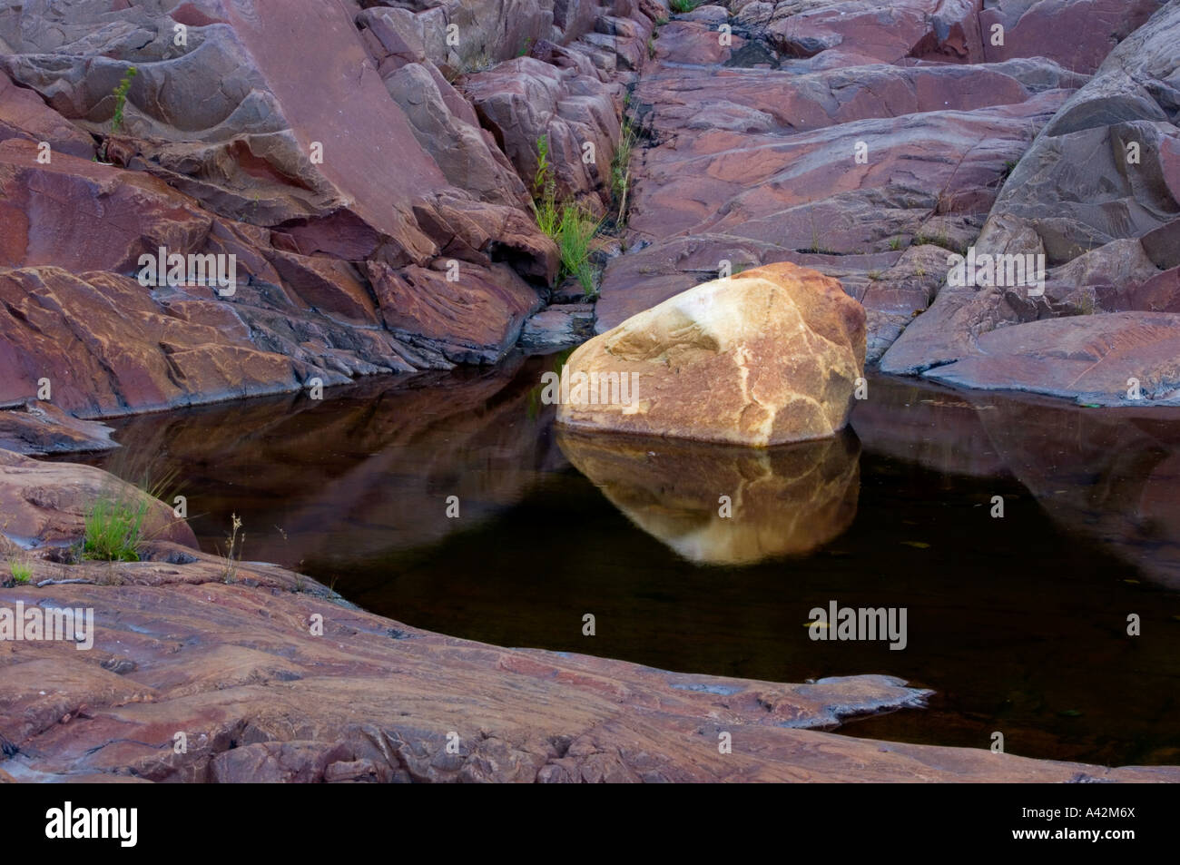 Weathered boulders and pool along Lake Huron shore, Killarney, Ontario ...