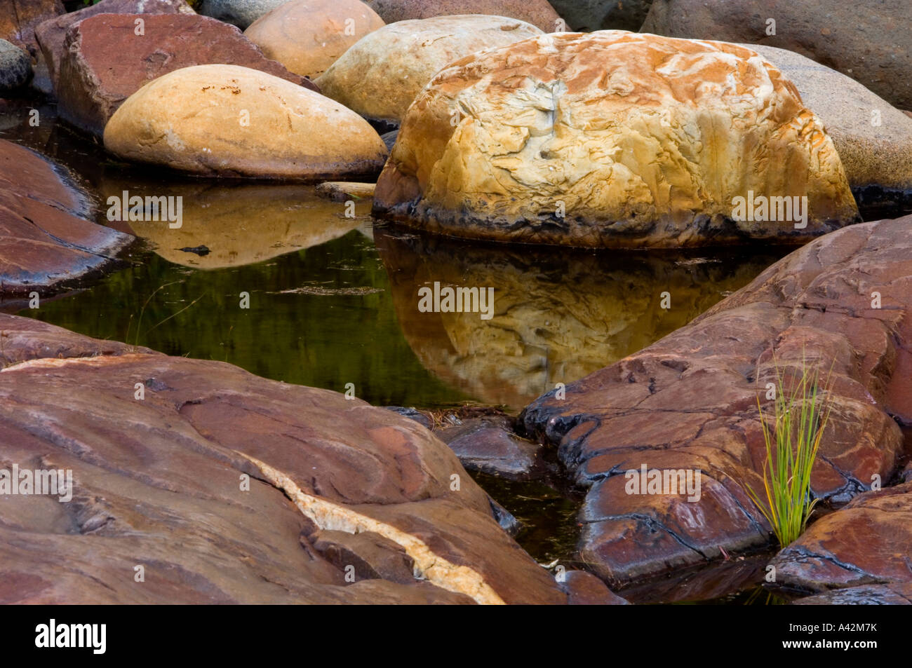 Weathered boulders and pool along Lake Huron shore, Killarney, Ontario ...