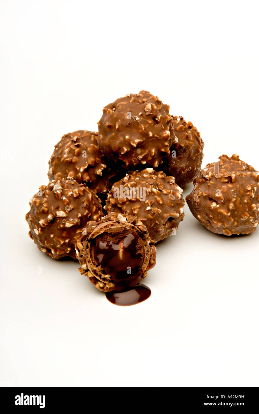 Chocolate Hazel Nut balls on white background Stock Photo - Alamy