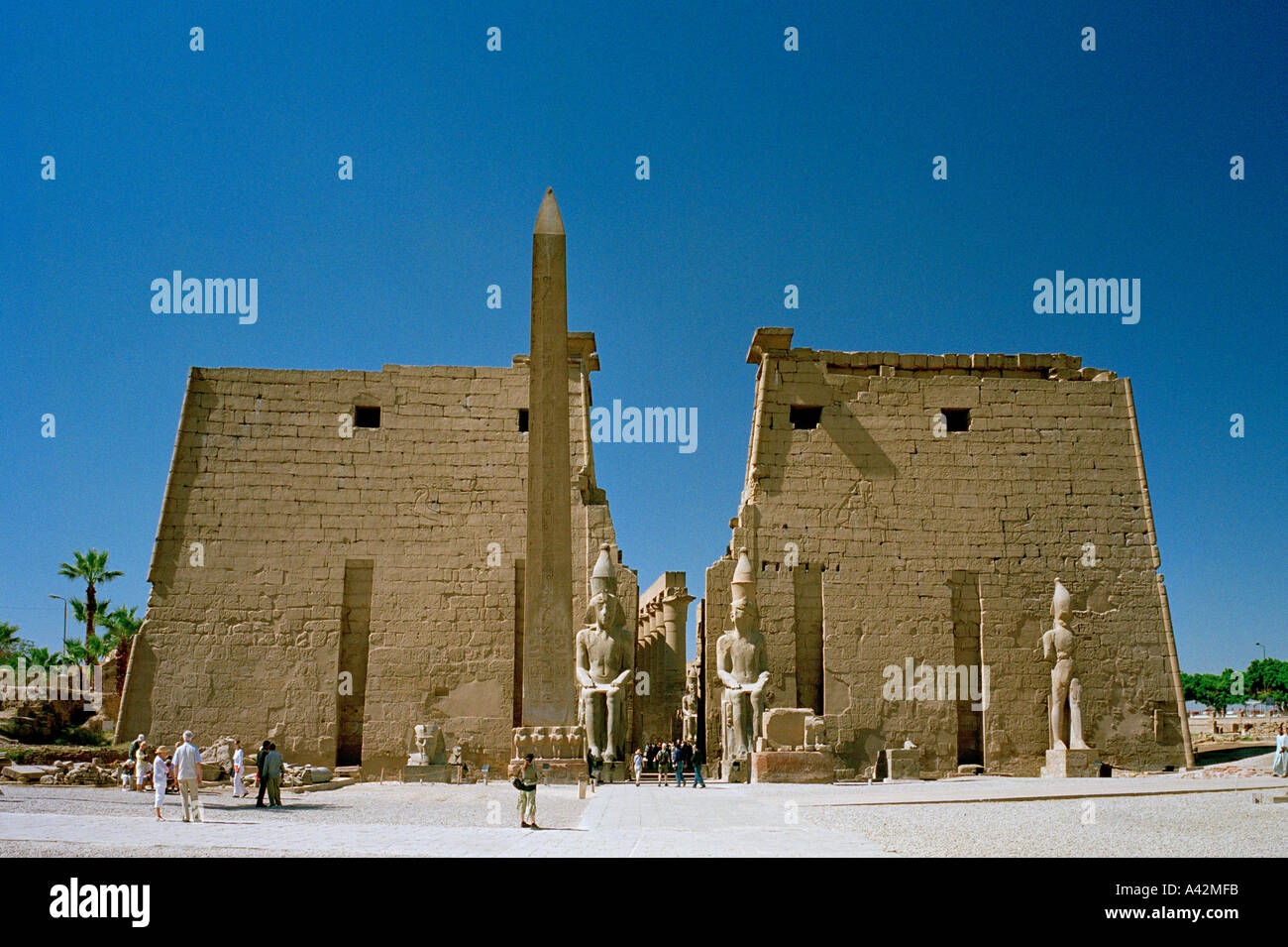 The magnificent Temple of Luxor with colossal statues of Ramses ll and ...