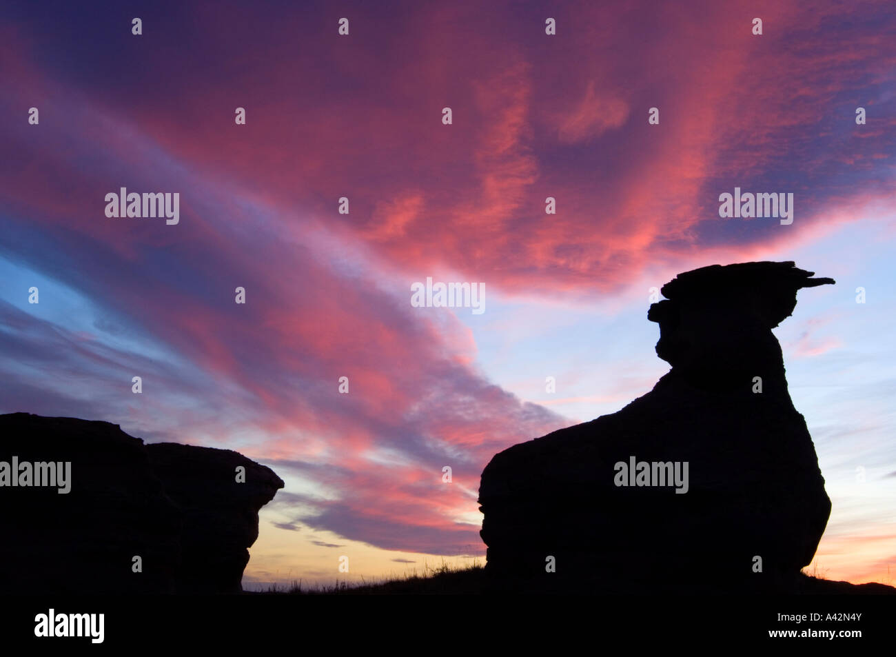Sunset skies over sandstone hoodoos, Writing on Stone Provincial Park ...