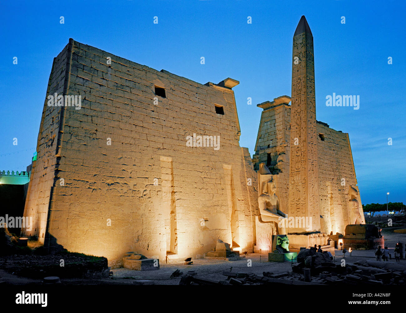 The magnificent Temple of Luxor at dusk with colossal statues of Ramses ...