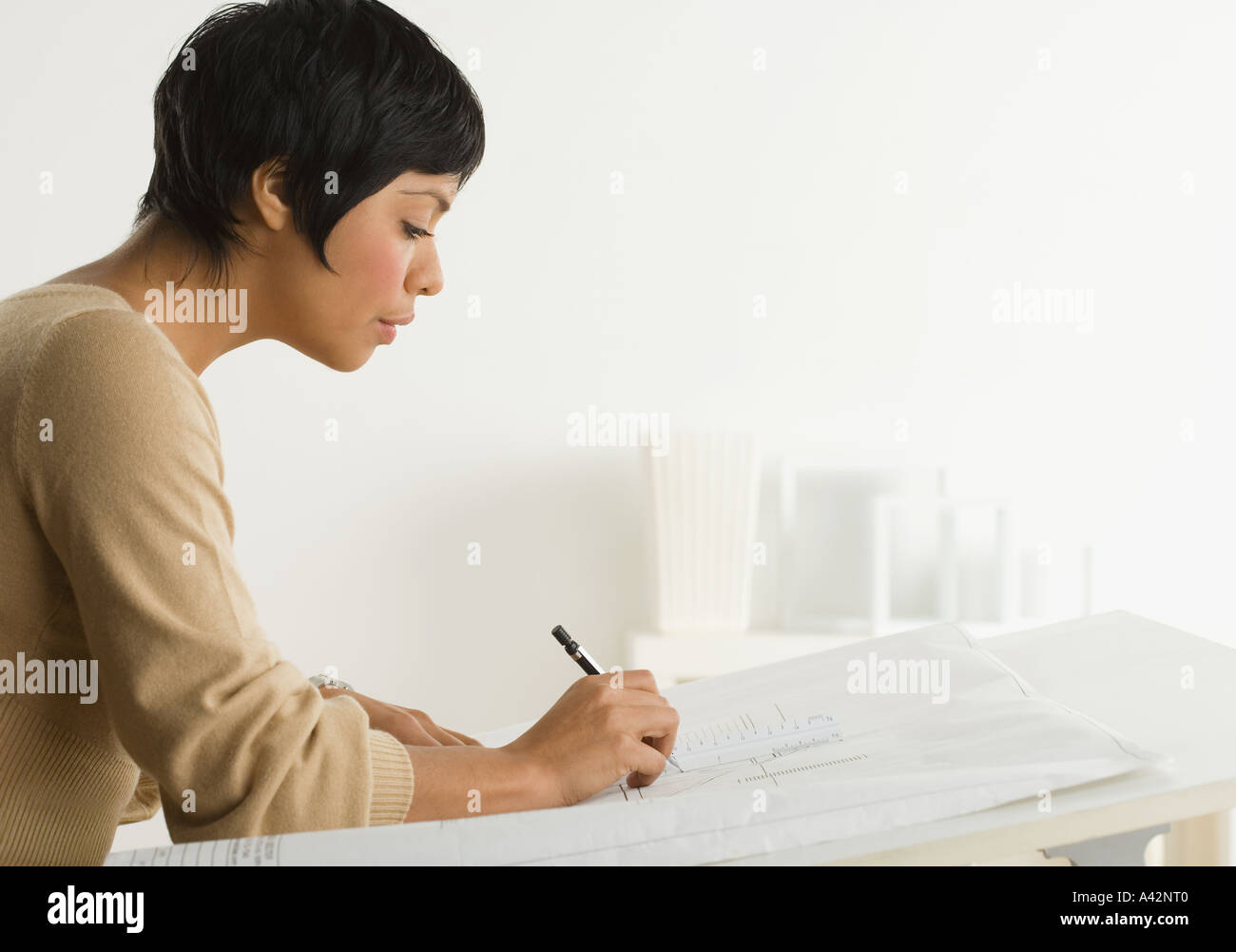 Profile of woman drawing plans Stock Photo - Alamy