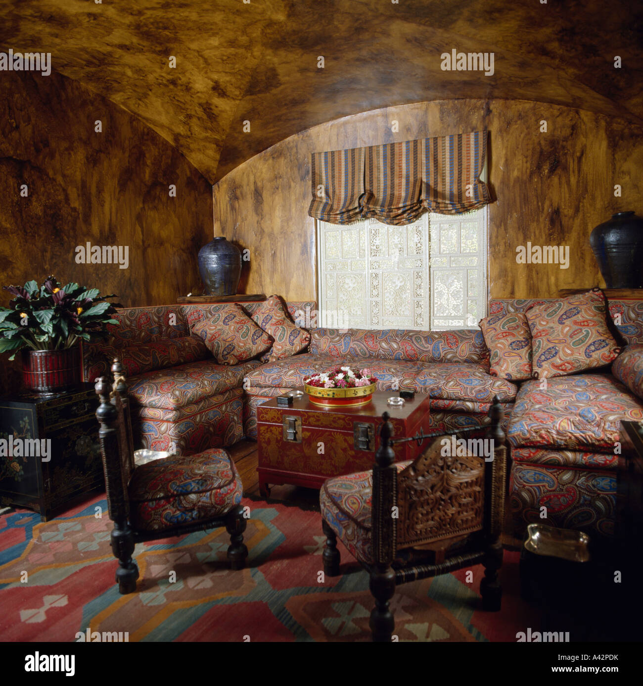 Patterned settee in eighties sittingroom with tortoiseshell paint ...