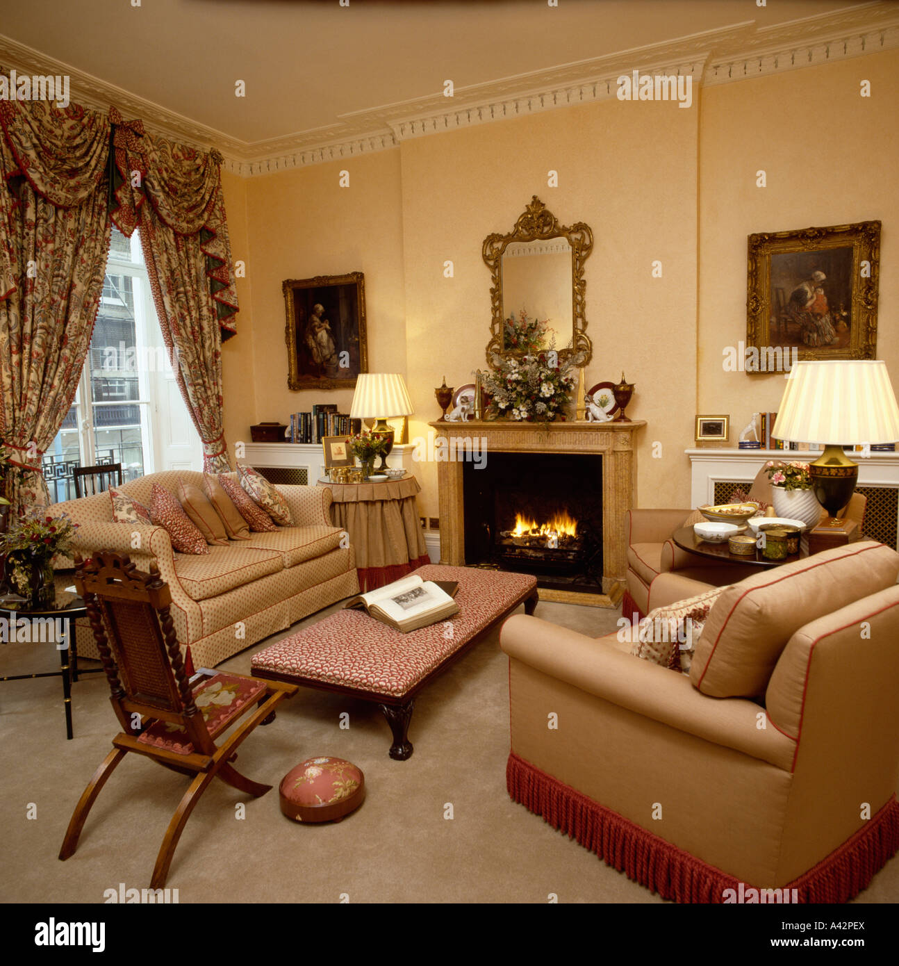 Neutral eighties sittingroom with fireplace and patterned settees and ...
