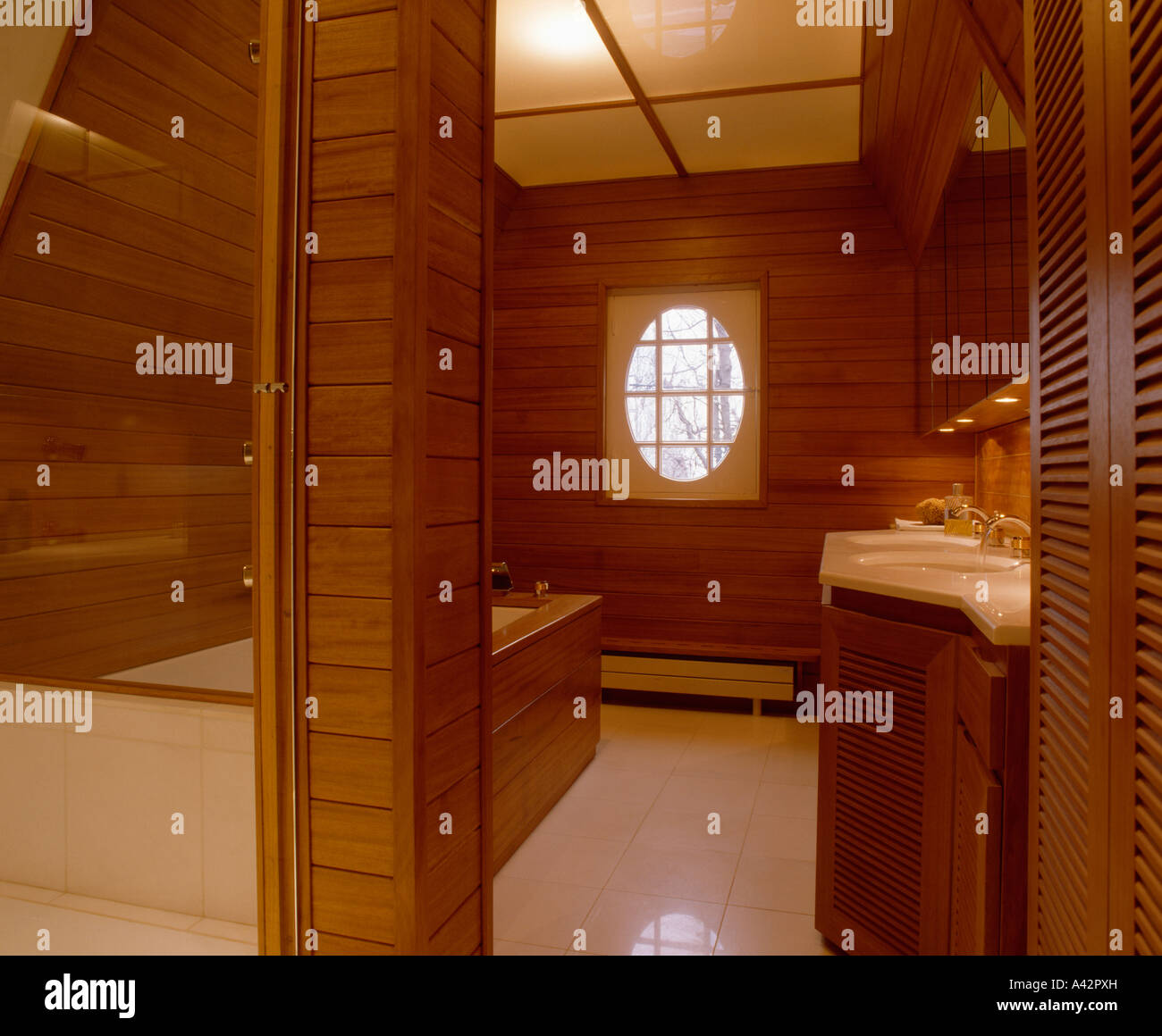 Wooden panelled bathroom with glass panelled ceiling Stock Photo - Alamy