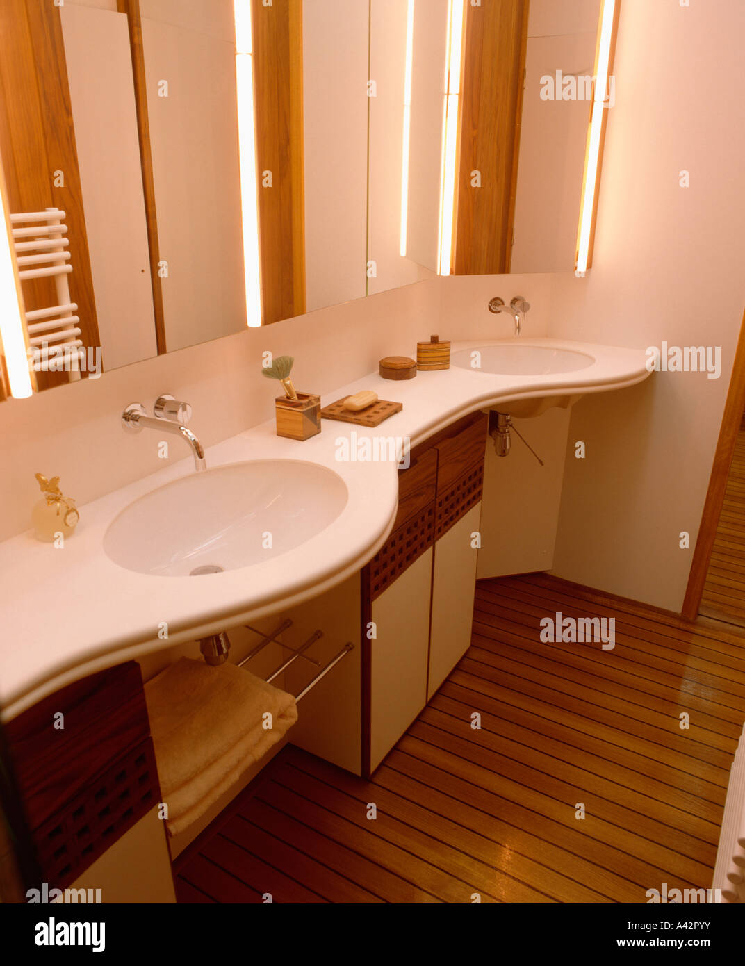 Basin in curved worktop in modern bathroom Stock Photo - Alamy
