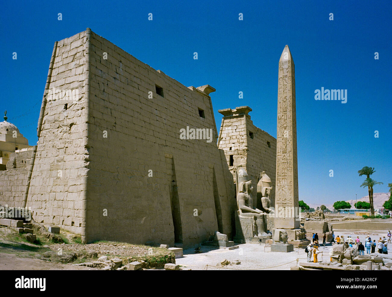 The magnificent Temple of Luxor with colossal statues of Ramses ll and ...