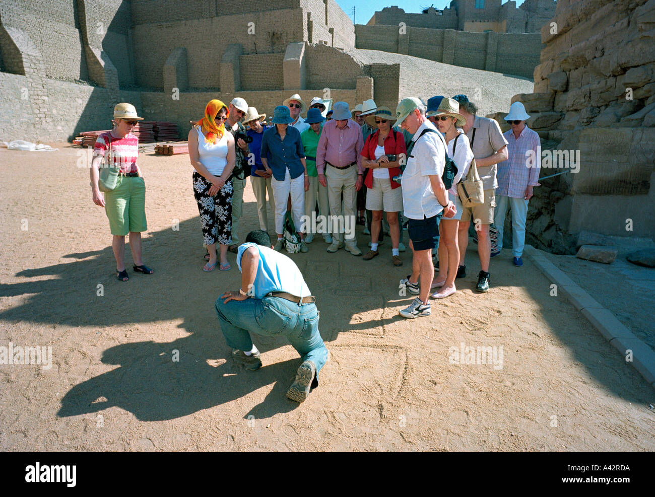 A tour guide graphically illustrating the architecture of the temple in ...