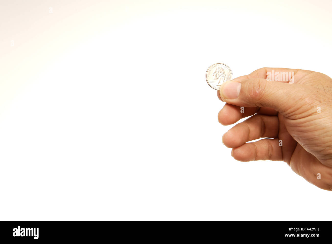coin hand showing coin Stock Photo - Alamy