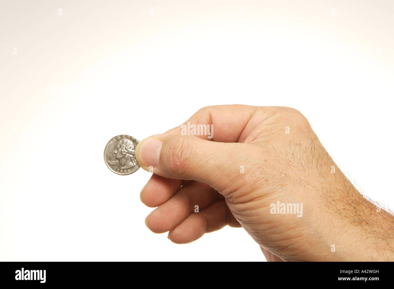 coin hand showing coin Stock Photo - Alamy