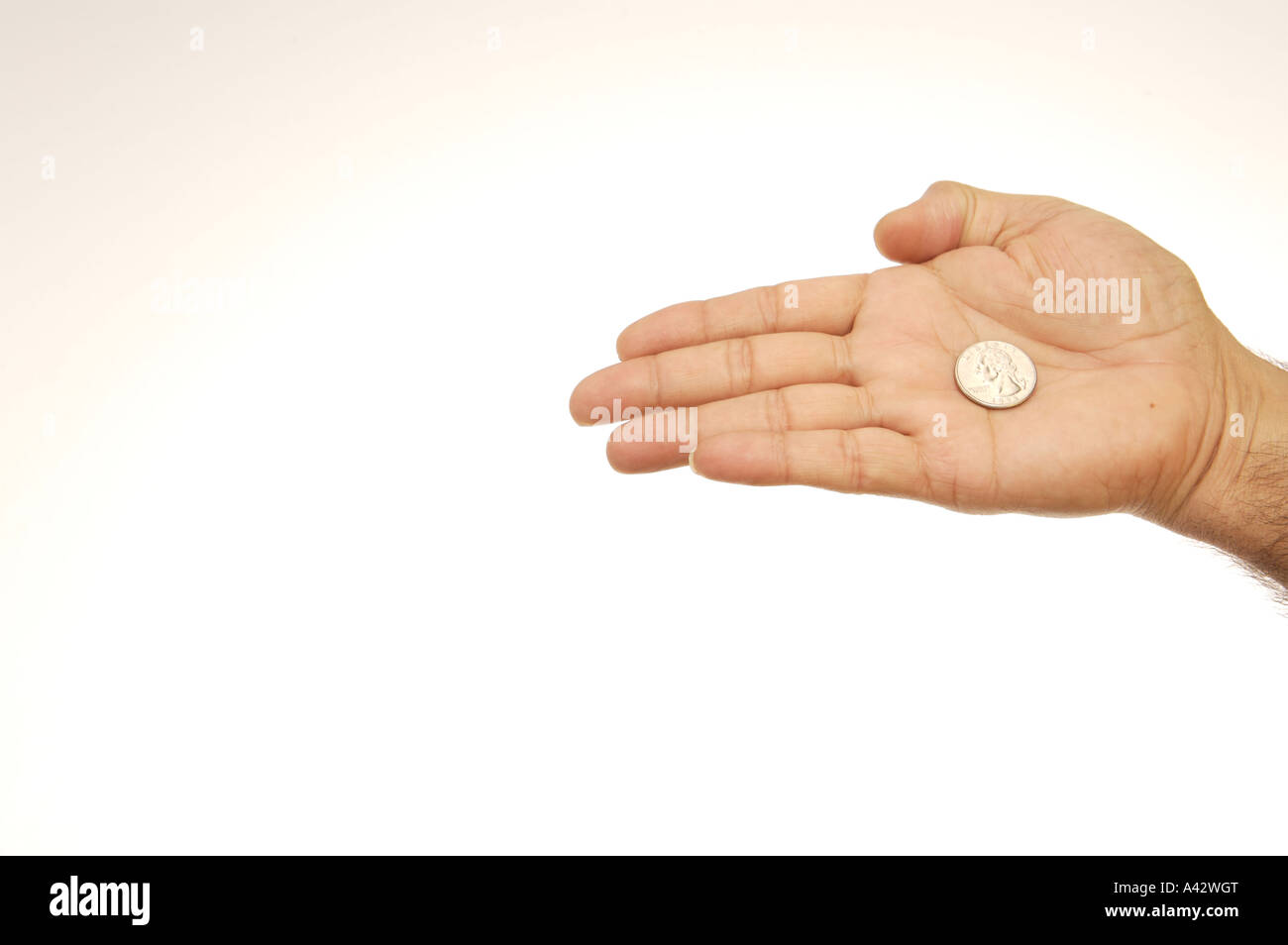 coin hand showing coin Stock Photo - Alamy