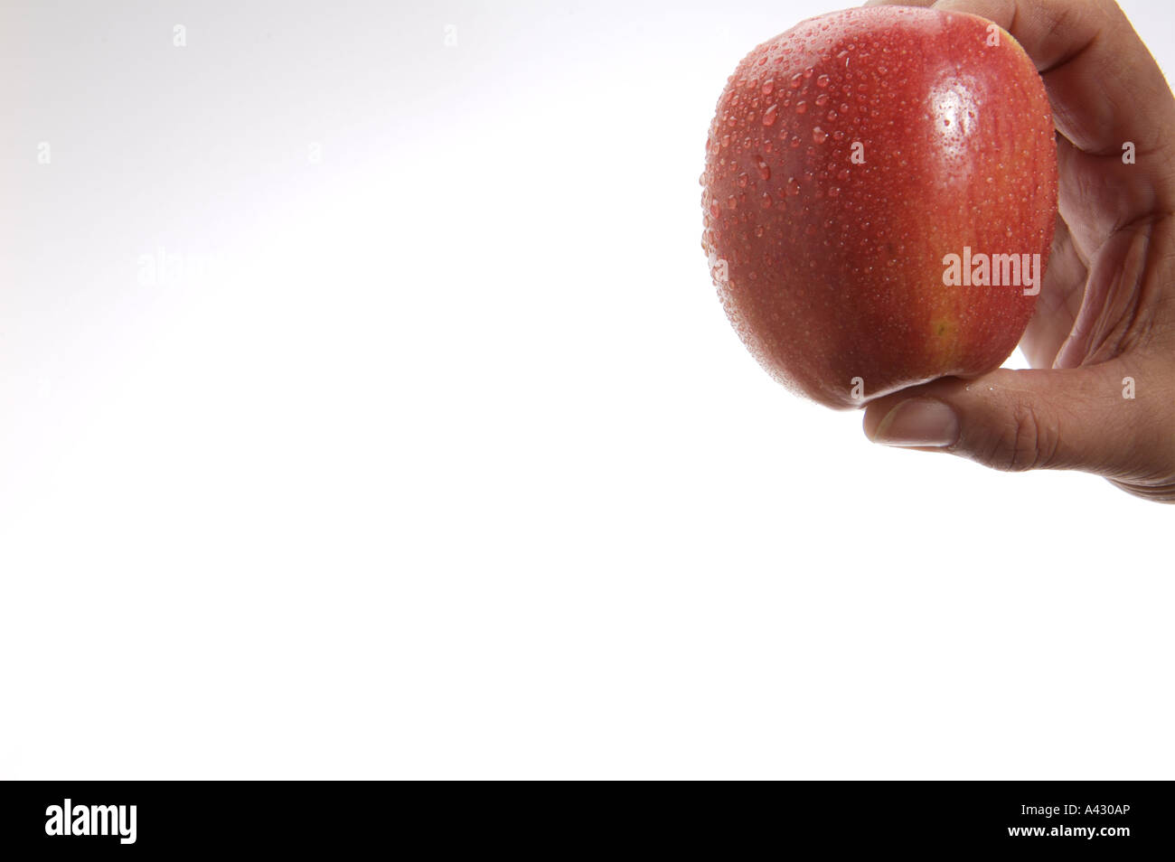 hand arm holding apple Stock Photo - Alamy