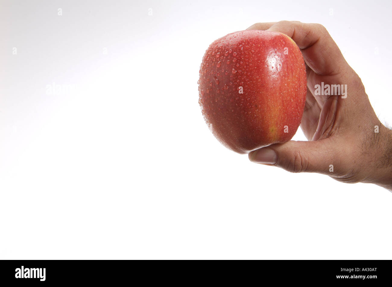 hand arm holding apple Stock Photo - Alamy