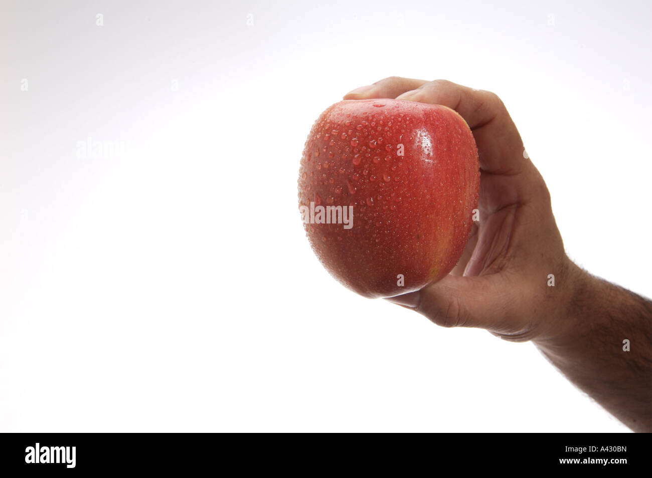 hand arm holding apple Stock Photo - Alamy