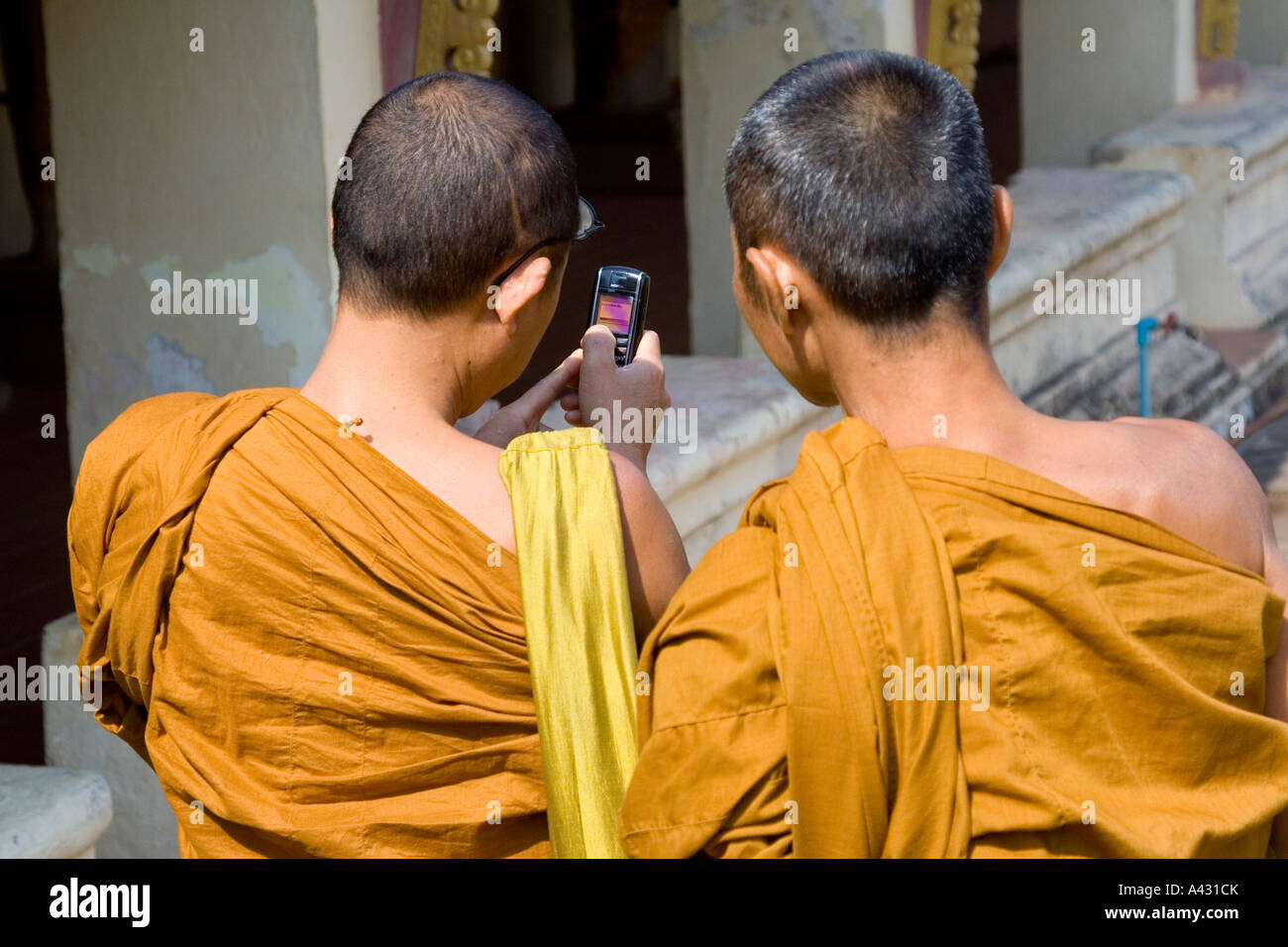 Two Monks use a Mobile Phone at Wat That Luang Vientiane Laos Stock ...