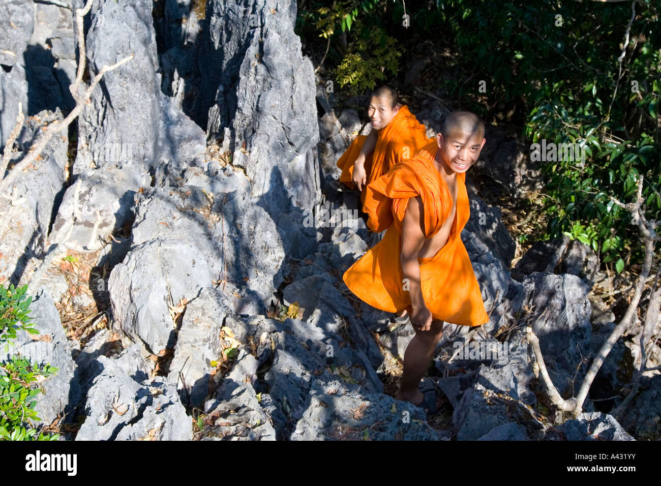 Novice and Monk Climbing Pha Poak Phouk Mountain View Vang Vieng Laos ...