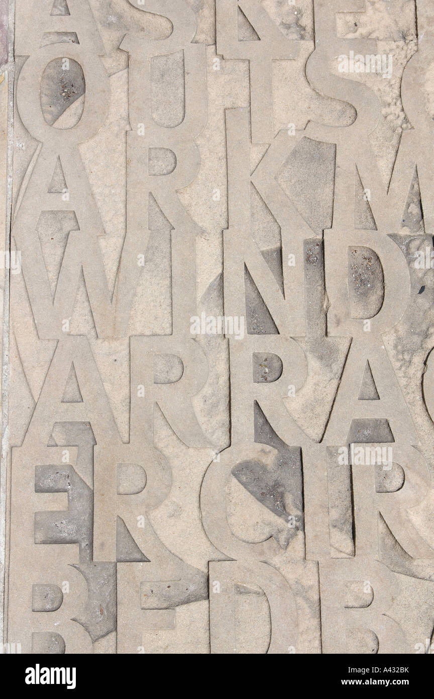 Carving of alphabet letters into pavement tiles, Melbourne Australia ...