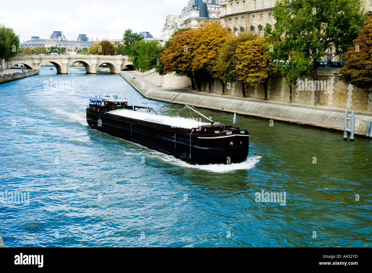 transport barge cruising down river Seine in Paris France Stock Photo ...